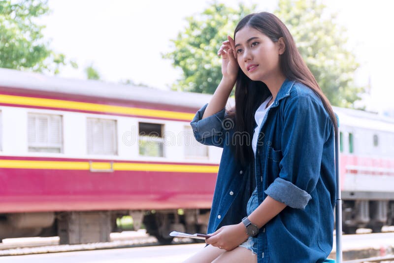 Traveler Woman Feeling So Hot And Tired While Waiting Someone At Train