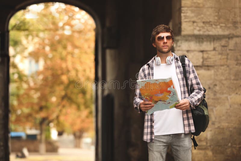 Traveler with World Map on City Street Stock Image - Image of person ...