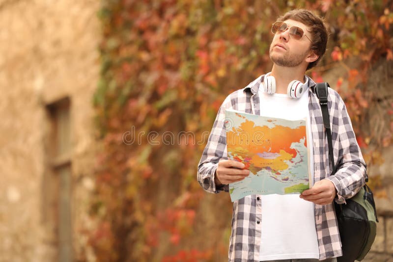 Traveler with World Map Near Building Outdoors Stock Photo - Image of ...