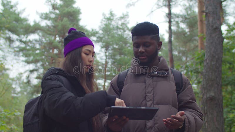 Travelers with Tablet Pc Arguing about Hiking Route Stock Video - Video ... Travelers with Tablet Pc Arguing about Hiking Route Stock Video - Video ...