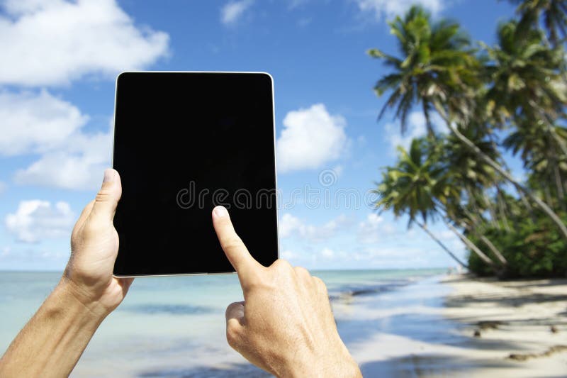 Traveling Tourist Using Tablet at Beach in Nordeste Bahia Brazil Stock ...