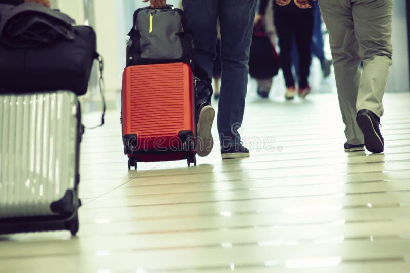 Traveller Pulling Suitcase at Airport Stock Photo - Image of airport ...