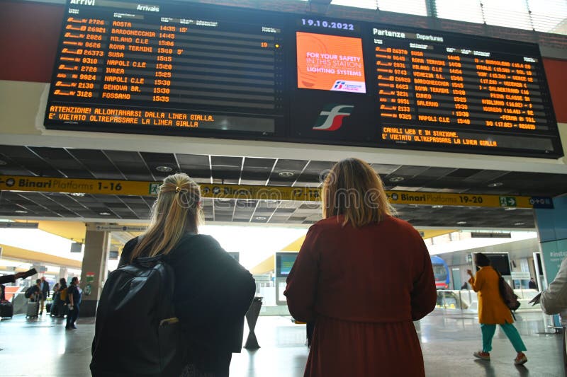 Travellers at Crowded Train Station Looking for Destinations on ...