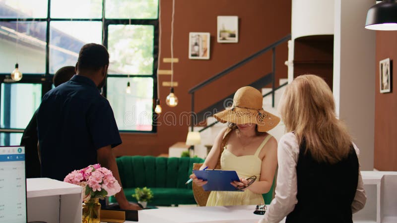 Travellers Signing Registration Forms Stock Footage - Video of ...