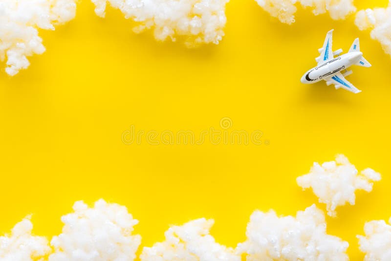 Fly by Plane Concept. Airplane Model and Clouds on Yellow Background ...