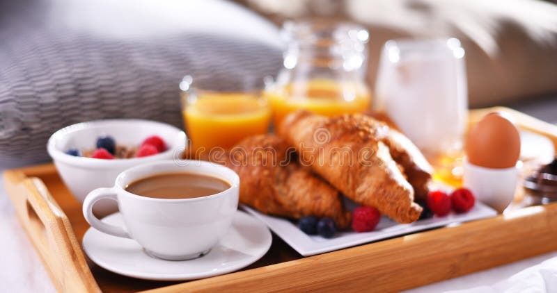 A Tray with Breakfast on a Bed in a Hotel Room Stock Photo - Image of ...