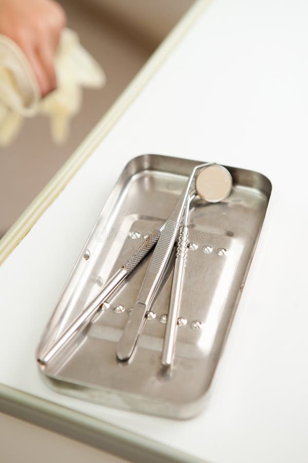 A Tray with Dentist`s Instruments on a White Table in the Clinic Office ...
