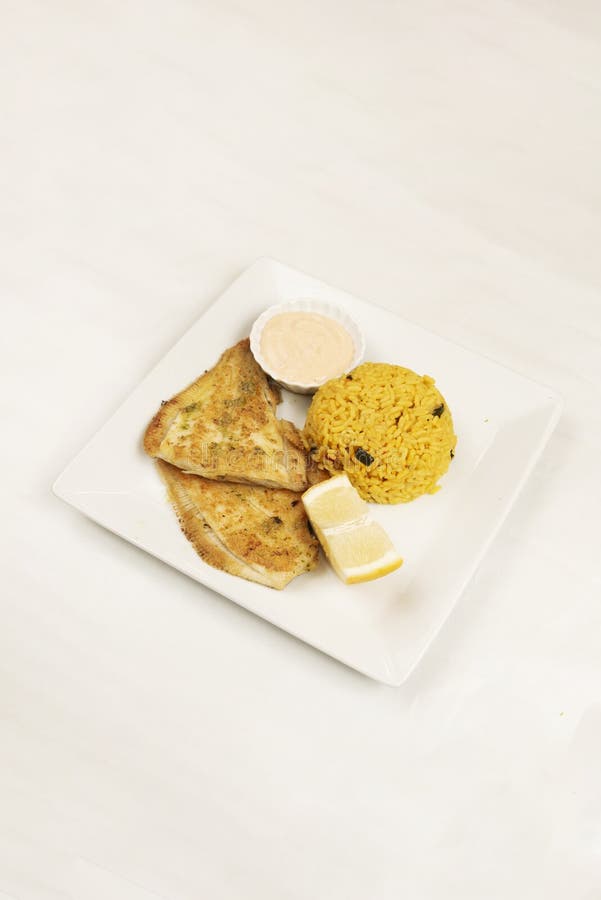 A Tray of Fried Flat Fish with a Bowl of Rice with Vegetables, Stock ...