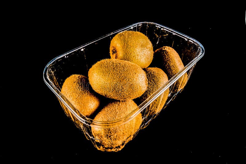 A tray of green kiwi fruit stock image. Image of round - 328101519