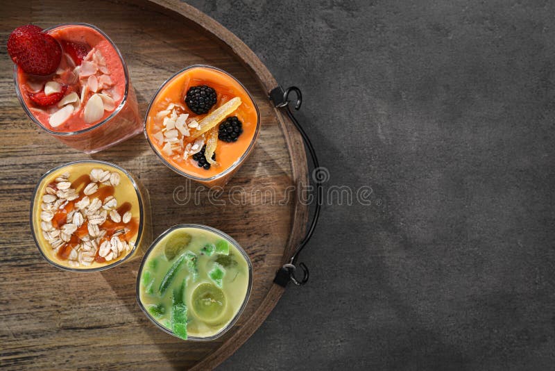 Tray with Many Different Delicious Smoothies on Grey Table, Top View ...