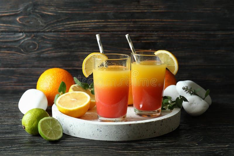Tray with Tequila Sunrise Cocktails on Wooden Table Stock Image - Image ...