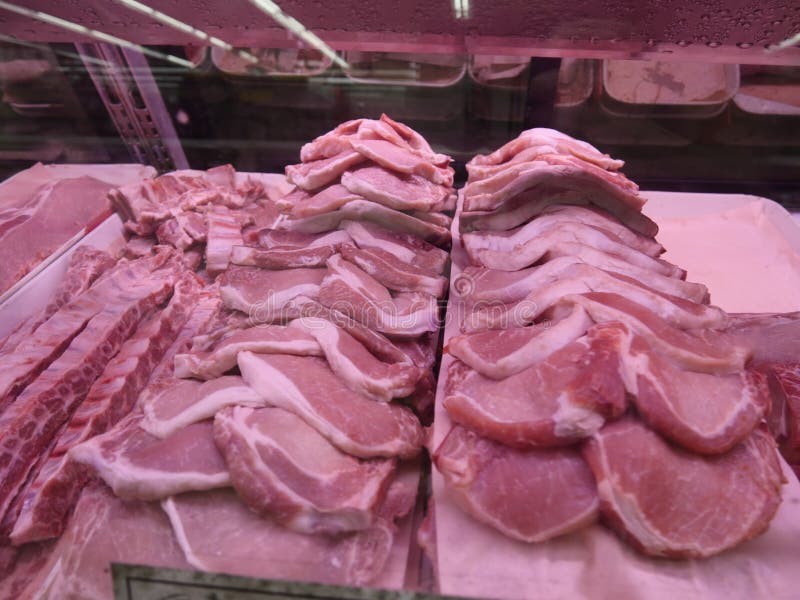 Trays of Raw Meat in the Fridge in a Butcher`s Shop Stock Photo - Image ...