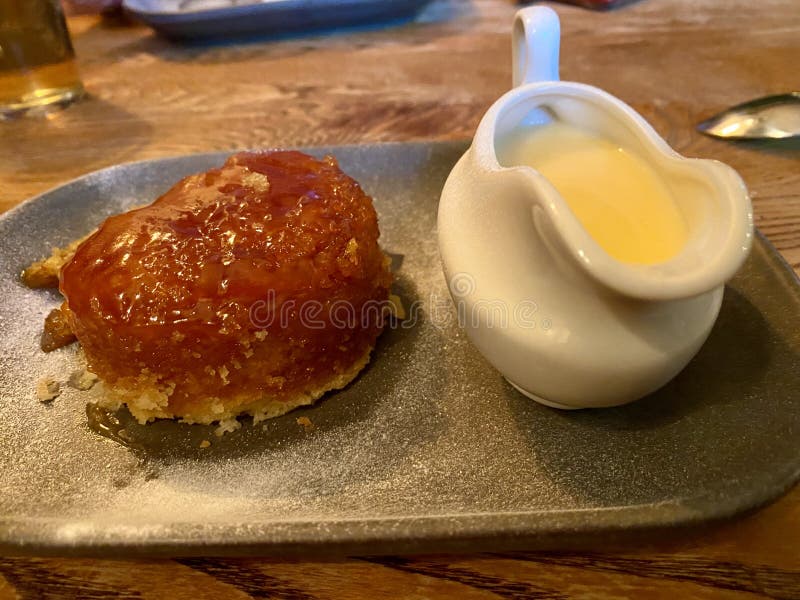Treacle sponge and custard stock photo. Image of dish - 264759428