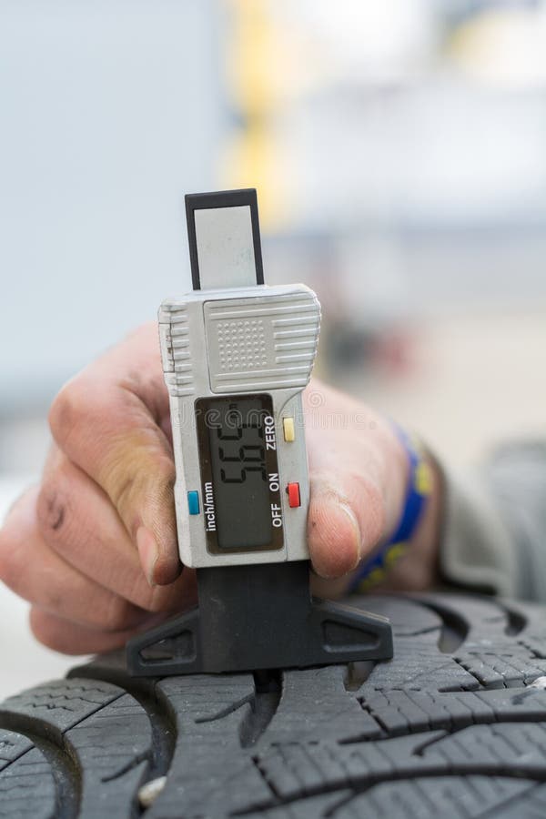 Measuring Tread in Winter Tyre Stock Photo - Image of responsible ...