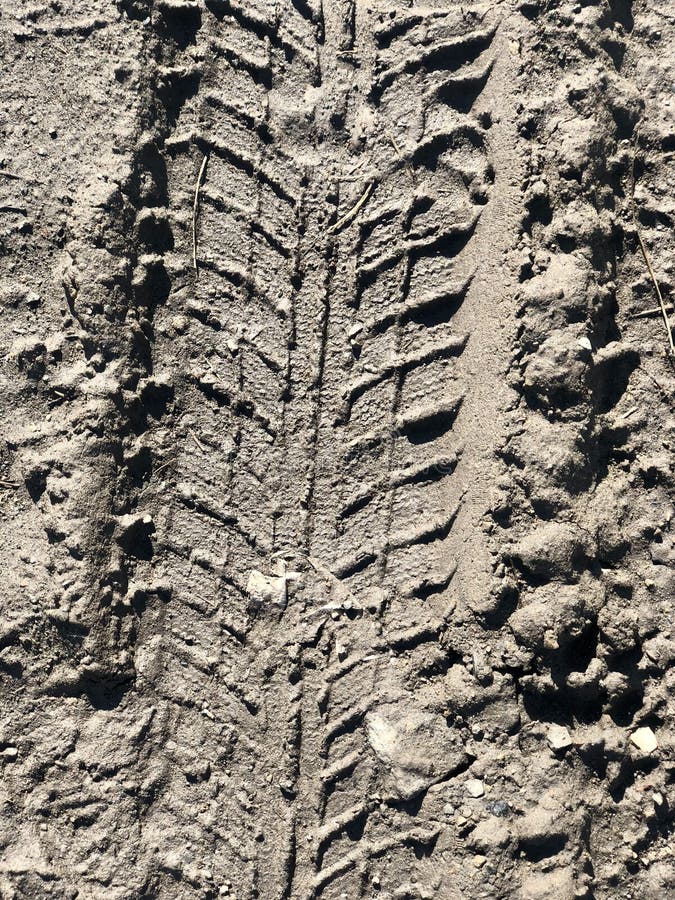 Tread mark on the ground stock image. Image of rock - 212932687