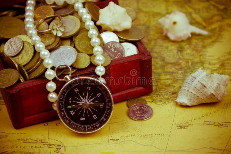 Treasure Chest with Jewelry and Coins, Compass and Shells on a Vintage ...