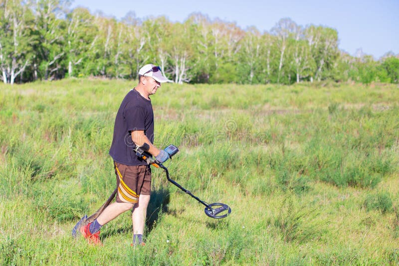 Treasure Hunter in the Field Looking for Old Coins and Artifacts Stock ...