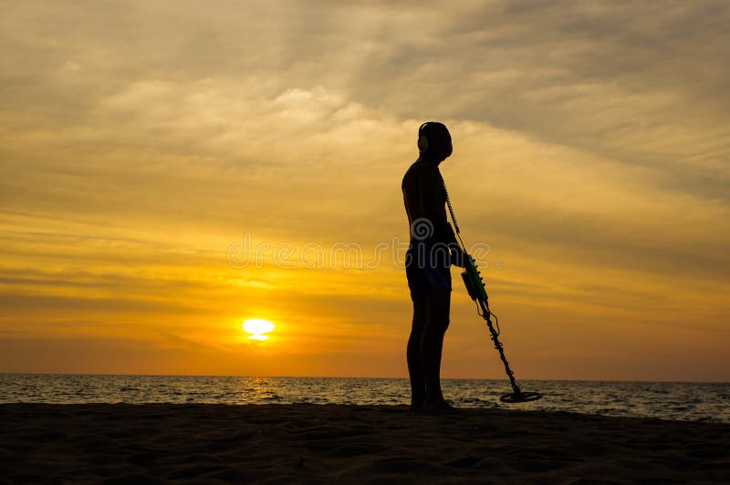 Treasure Hunter with Metal Detector on Sunset the Beach Stock Photo ...