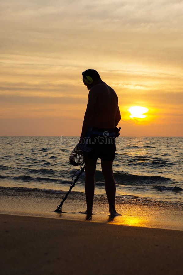 Treasure Hunter with Metal Detector on Sunset the Beach Stock Photo ...