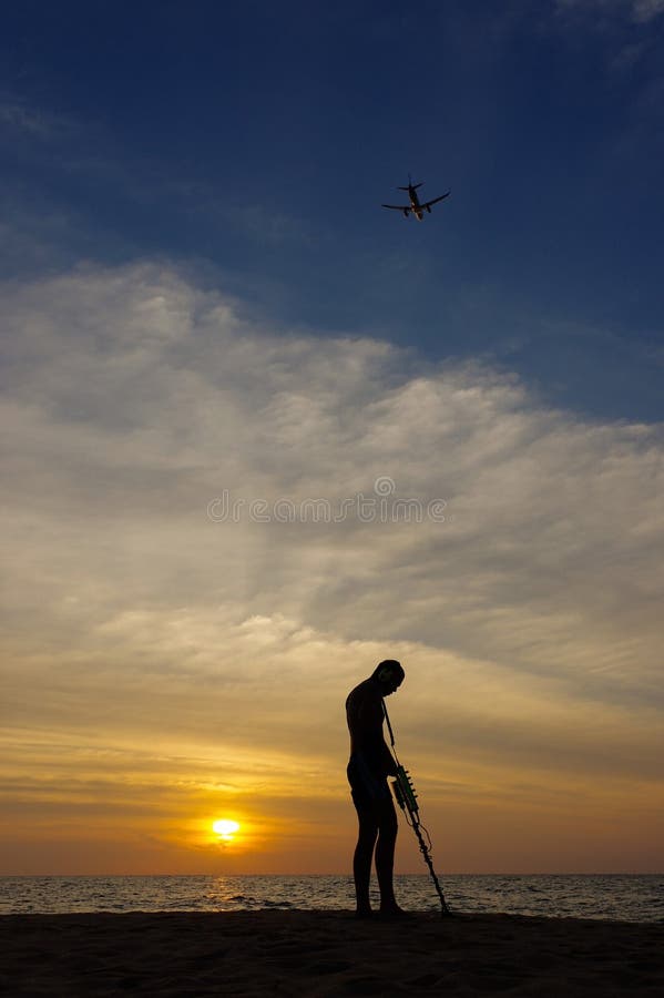 Treasure Hunter with Metal Detector on the Beach Stock Image - Image of ...