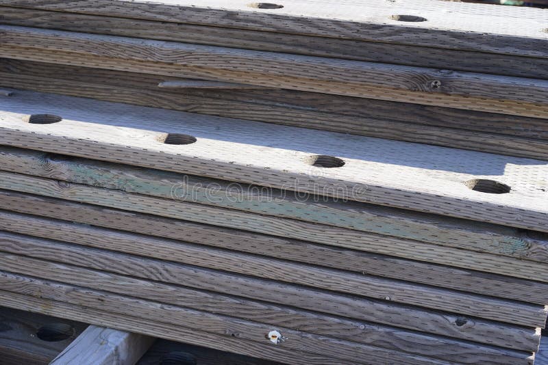 Treated wood stacked up stock photo. Image of planks - 220783382