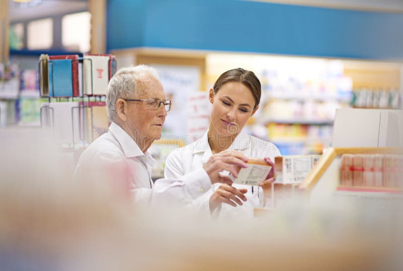 Treating Every Client As an Individual. a Young Pharmacist Helping an ...