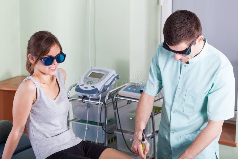 Treating Leg Using Laser Therapy Stock Photo - Image of helping, physiotherapy: 41993930