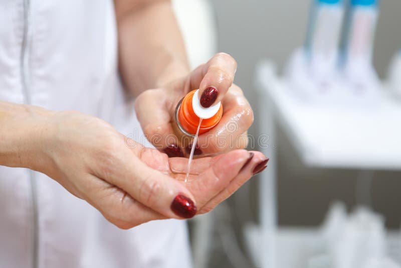 Treatment of Hands with an Antiseptic Stock Image - Image of ...