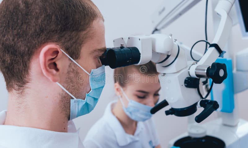 Treatment of Root Canals Under a Microscope, Work with an Assistant ...