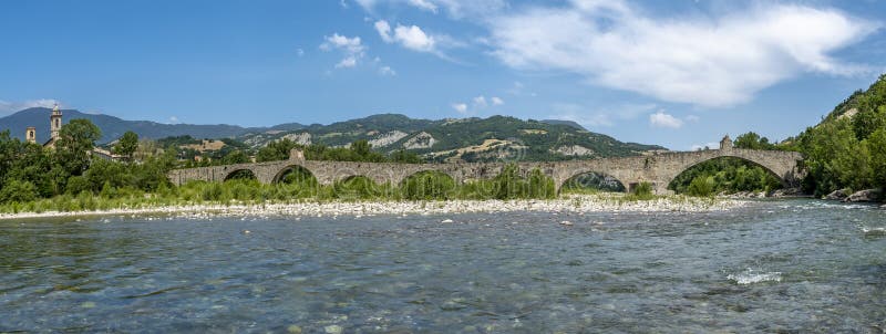 The Trebbia River Flows Under the Ancient Gobbo Bridge in Bobbio, Italy ...