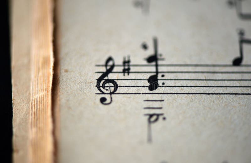 Treble Clef and Musical Notes in the Old Musical Notebook Stock Photo ...