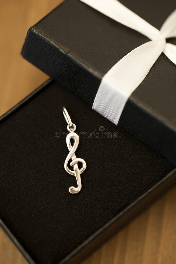 Treble clef on necklace stock photo. Image of silver - 173234150