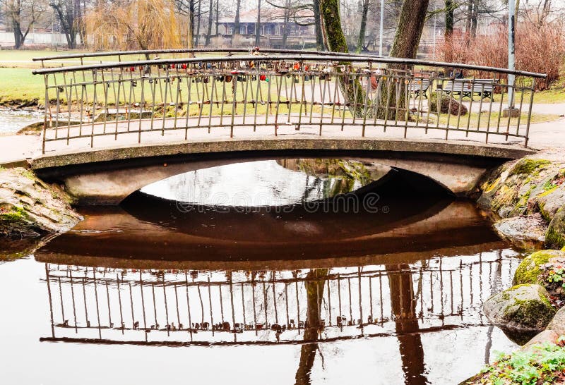 Bridge reflection in water stock photo. Image of reflections - 83004304