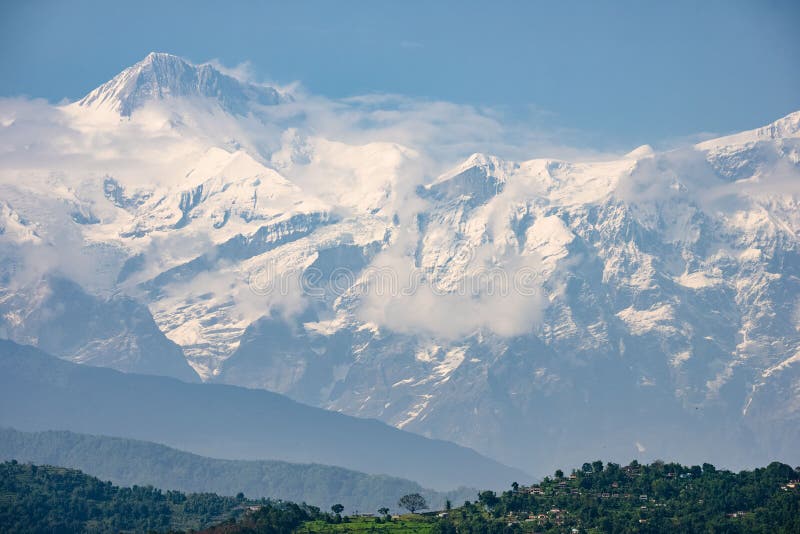 Tree-covered Hills before the Annapurna Himalayan Mountain Range in ...