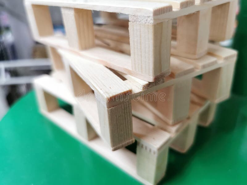 Tree Empty Pallets on Green Blurred Background Stock Image - Image of ...