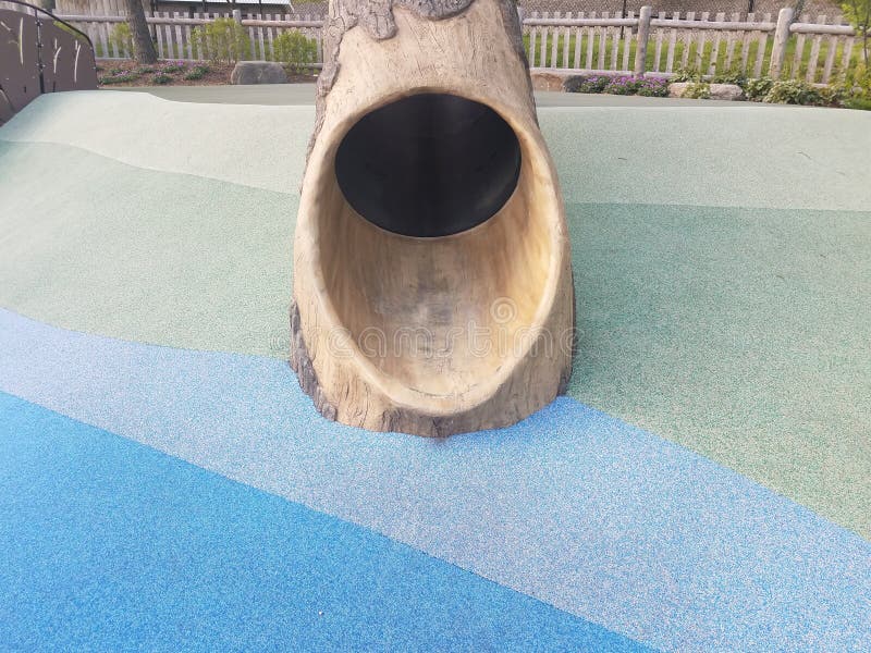 Tree Log Slide on Playground with Blue Surface Stock Photo - Image of ...