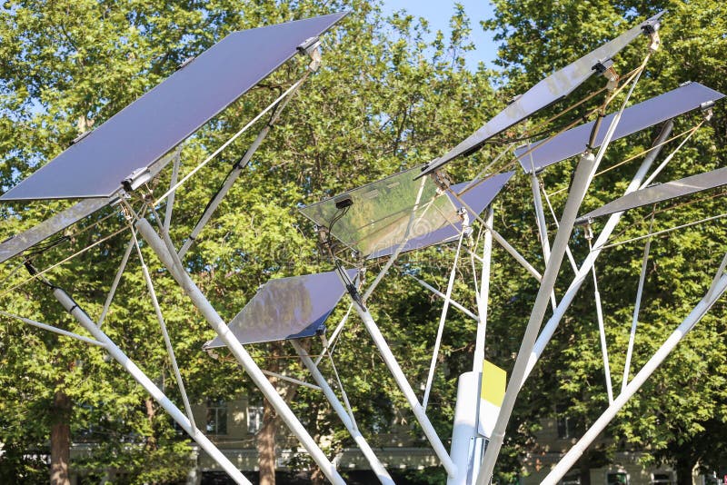 Tree Shaped Solar Panels. Smart Charging Solar Panels Tree and a Man ...