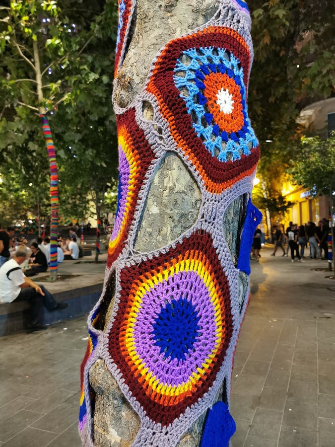 Tree Trunk in a Knitted Cover Made of Multi-colored Patterns. Editorial ...