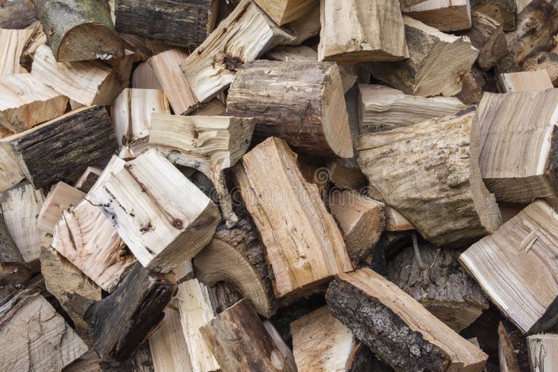 Tree Trunks Cut and Chopped in a Heap Ready To Be Laid. Fuel Stock ...