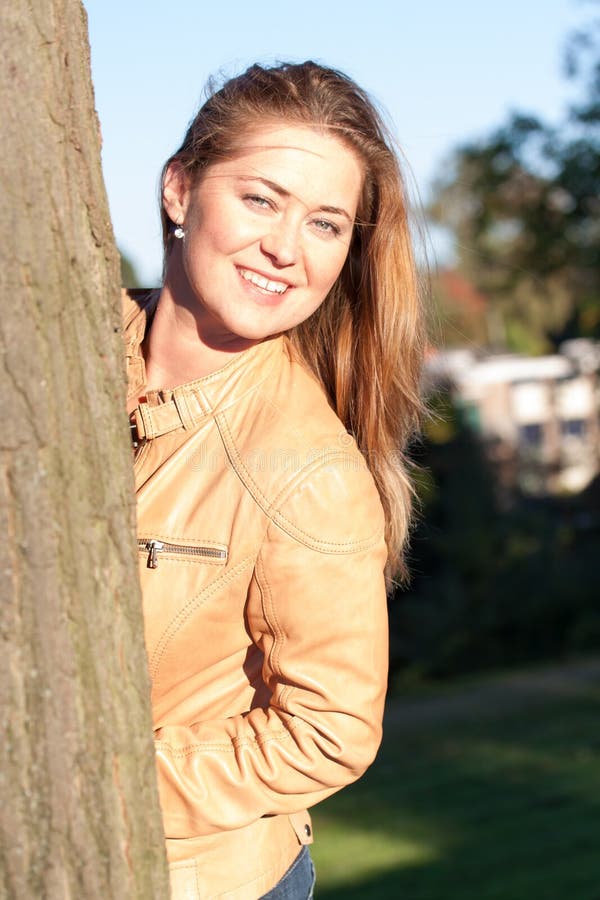 Tree woman stock image. Image of outdoor, woman, smiling - 45577963