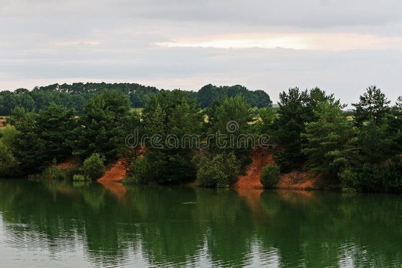 Trees Border Reflection at the Lake Stock Photo - Image of trees, green ...