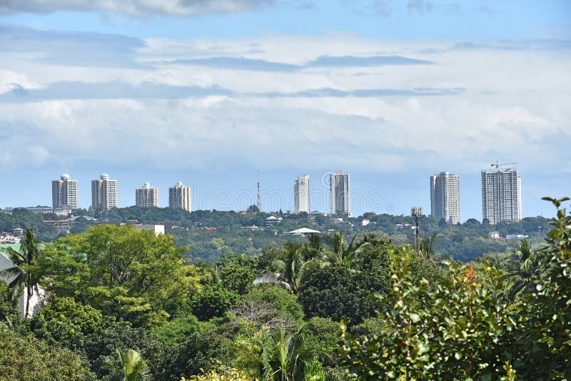 Trees and City Skyline on Horizon Editorial Photo - Image of city ...