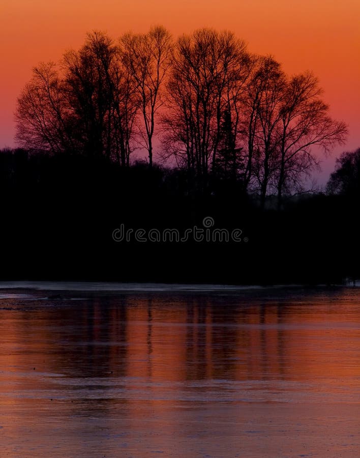 Trees, Frozen Lake, and Sunset Stock Image - Image of frozen, sunset ...
