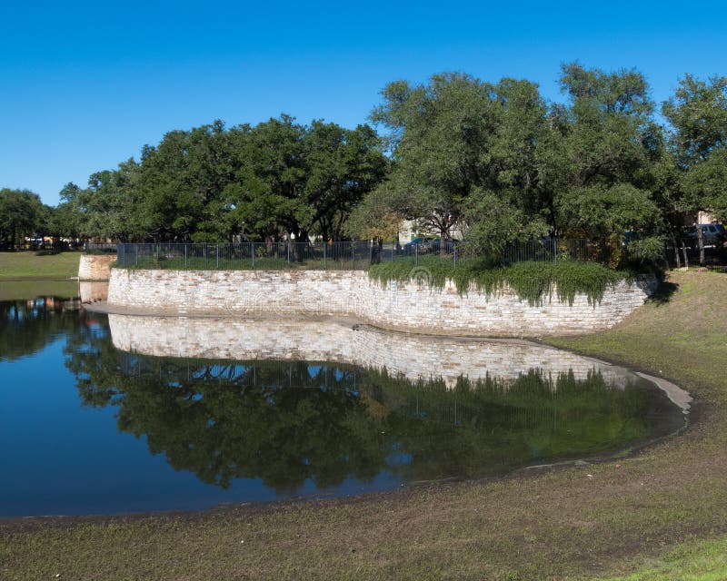 Trees Reflected in a Retention Pond Stock Photo - Image of environment ...