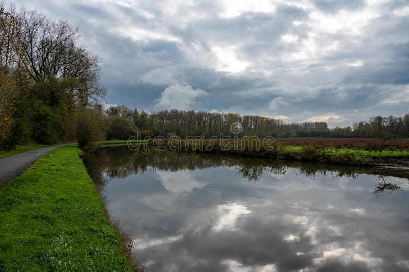 Trees Reflecting in the Water of the River Dender, Erembodegem, Belgium ...