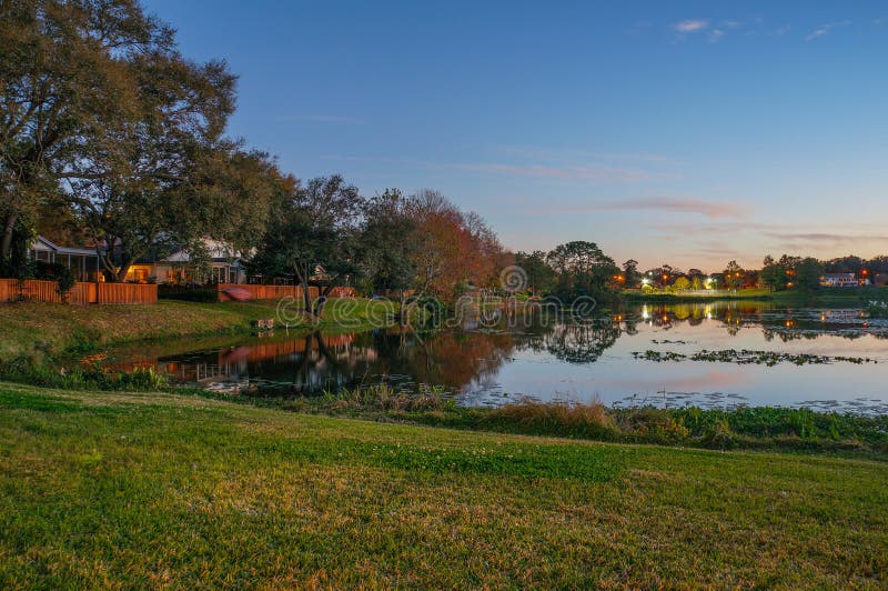 Trees and a Small Pond Form Perfect Reflection at Sunset Stock Image ...