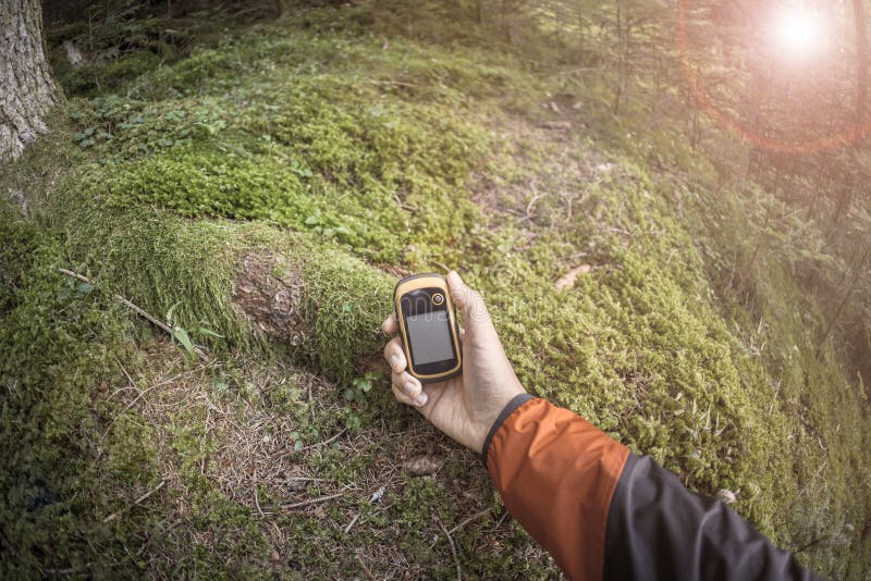 A Trekker Using Gps among the Forest in a Cloudy Day Stock Image ...