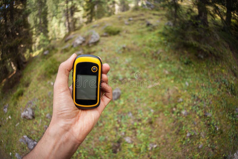 A Trekker Using a Gps Inside the Forest Stock Photo - Image of ...