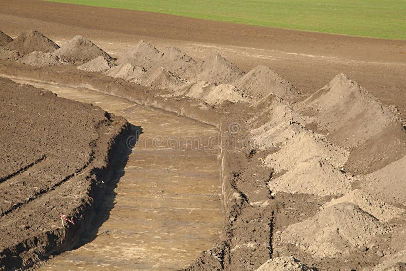 Trench digged on a land stock image. Image of digging - 97696657