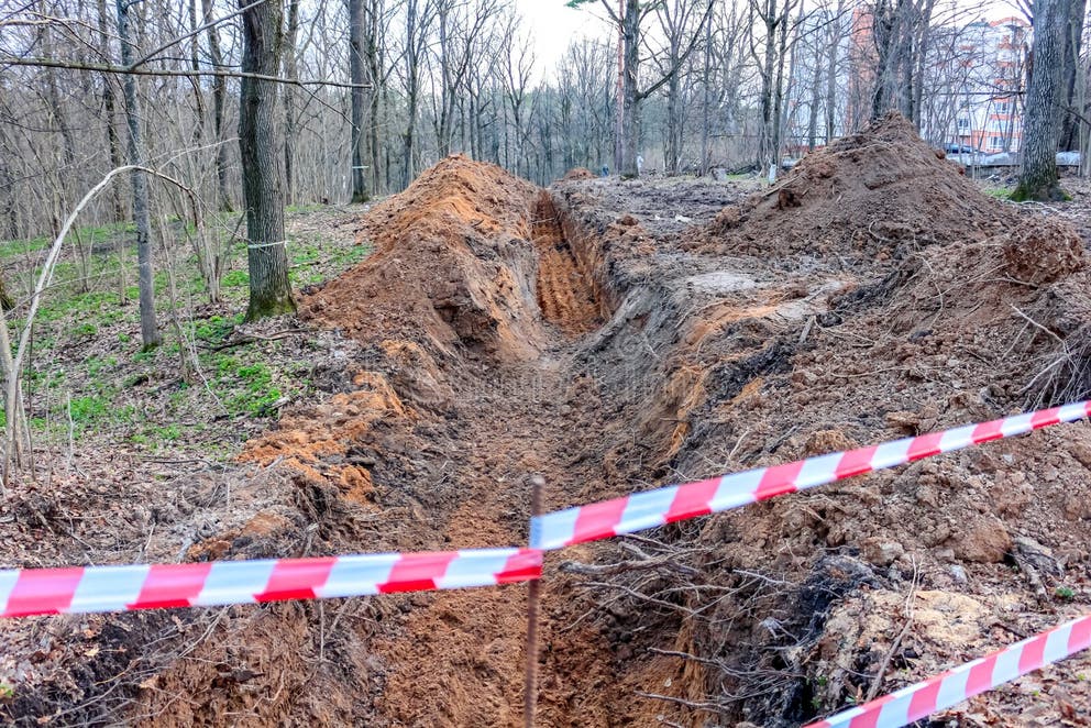 Trench in the forest stock photo. Image of installation - 140750242
